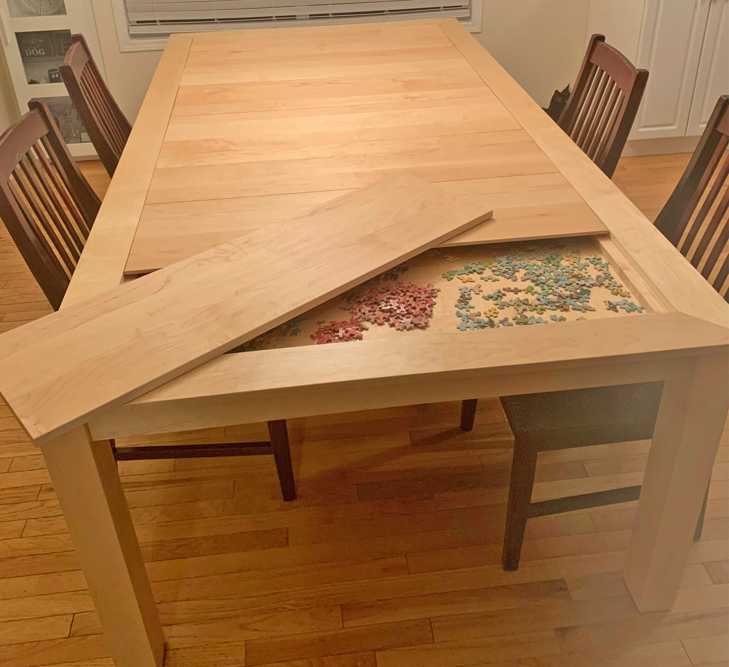 This Amazing Dining Table Has A Hidden Game Puzzle Compartment Under